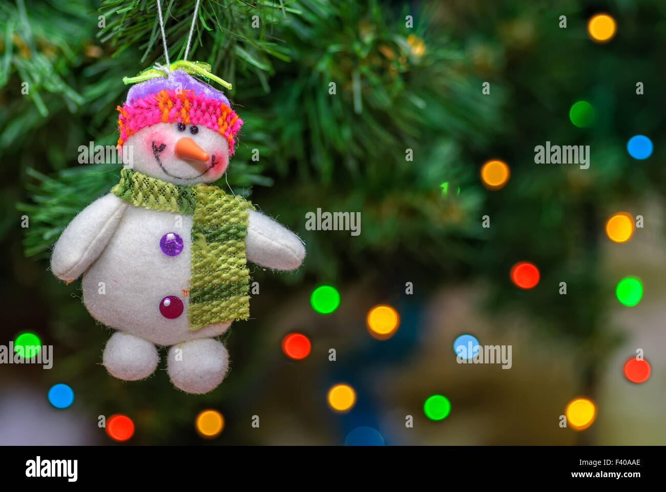 Snowball toy on christmas tree Stock Photo - Alamy