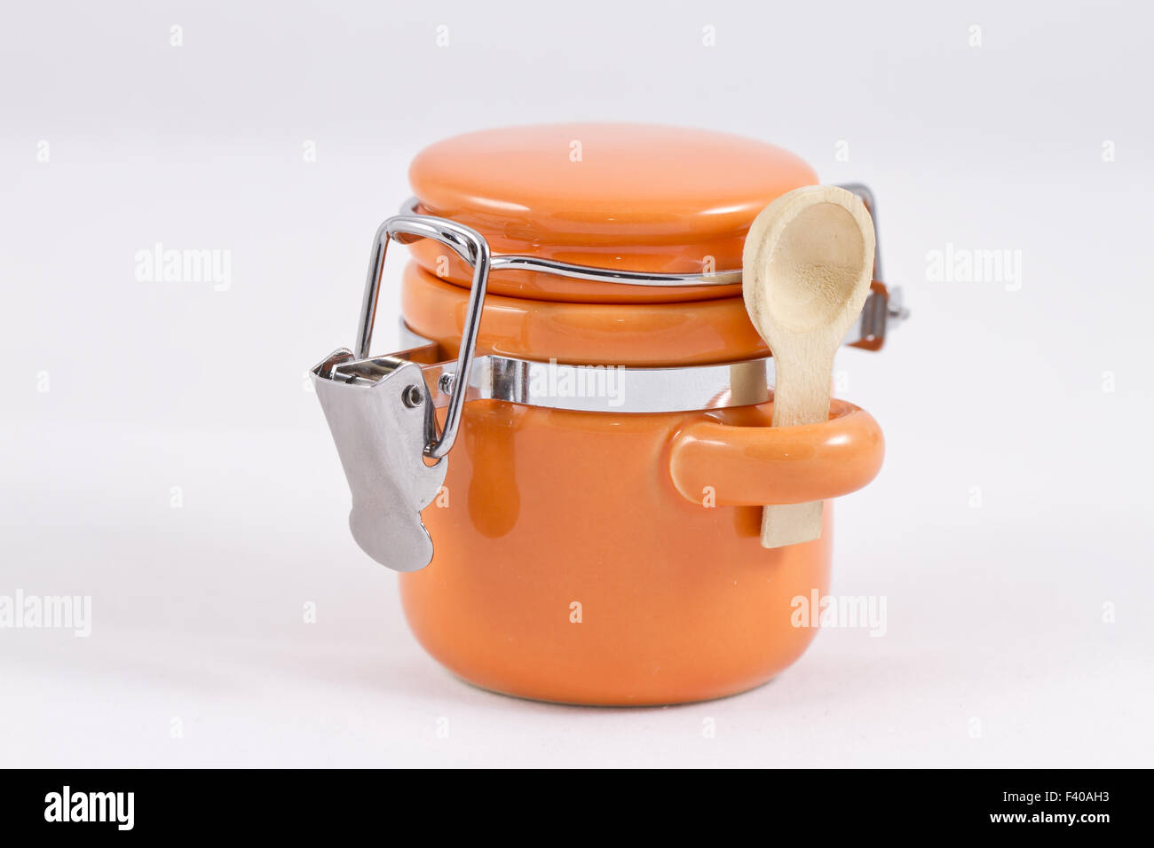Ceramic orange salt shaker with a lid Stock Photo - Alamy