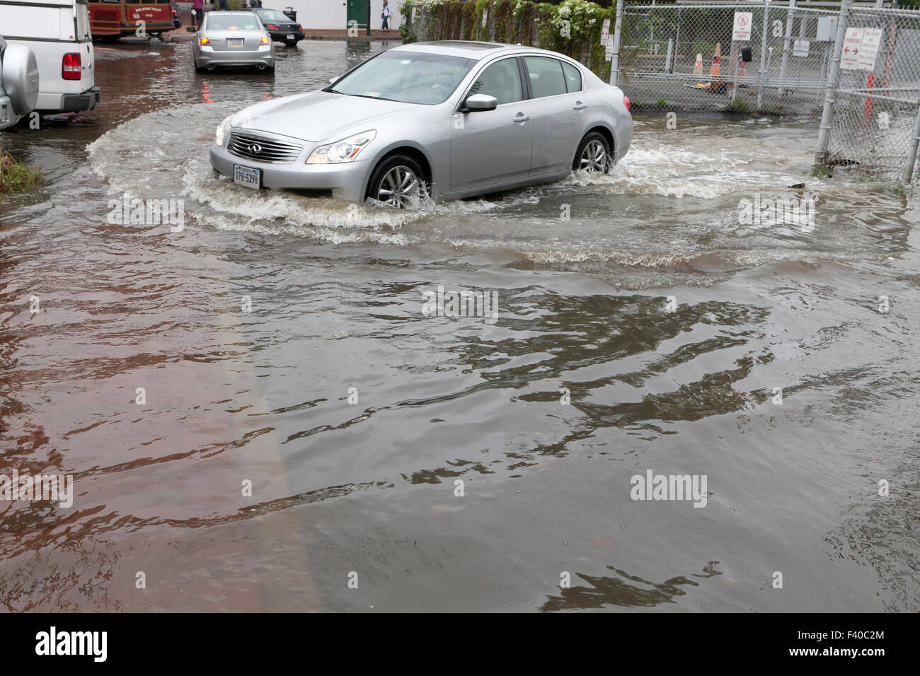 Car driving through floodwater hi-res stock photography and images - Alamy