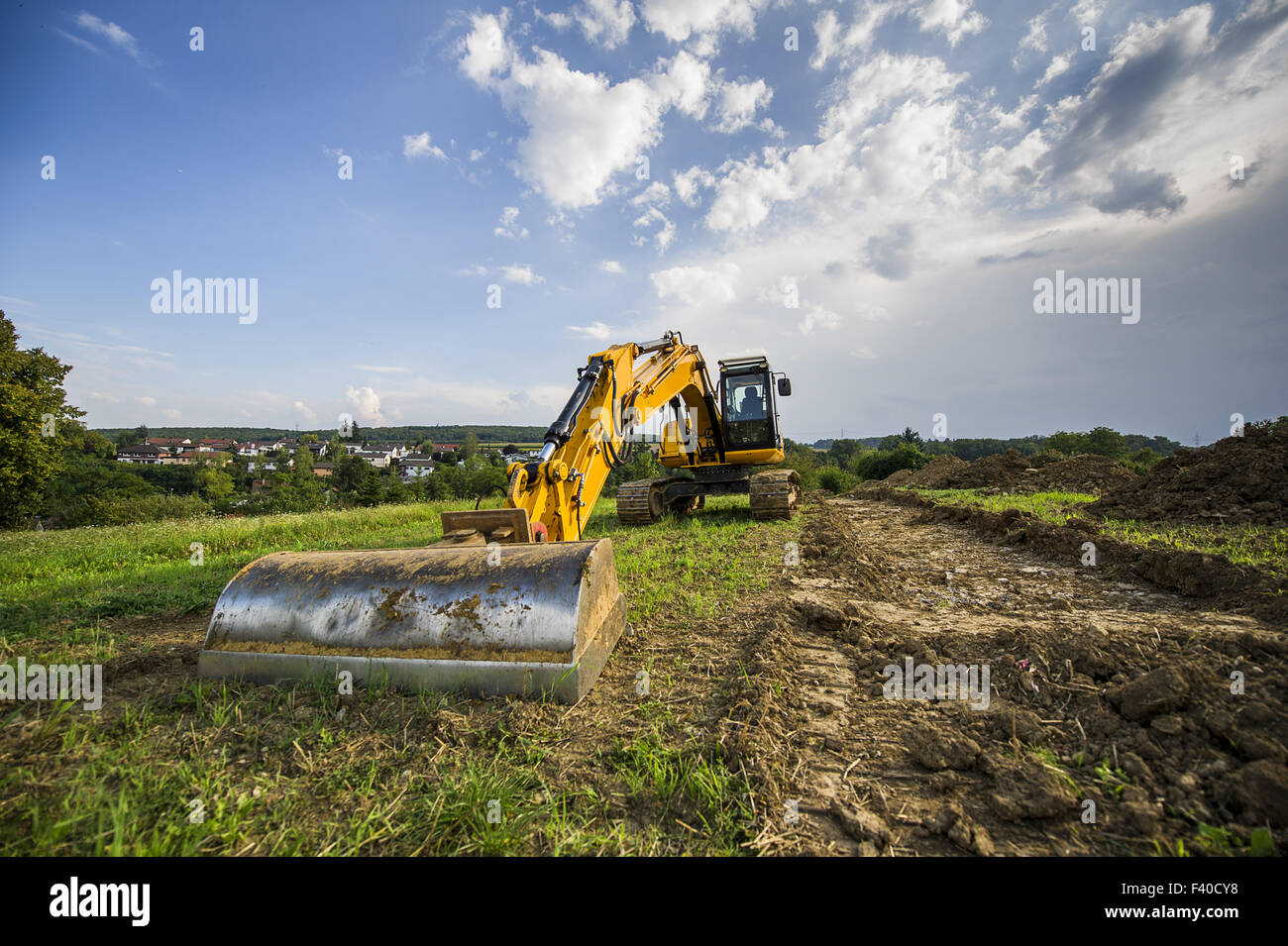 Excavator on a construction site Stock Photo - Alamy