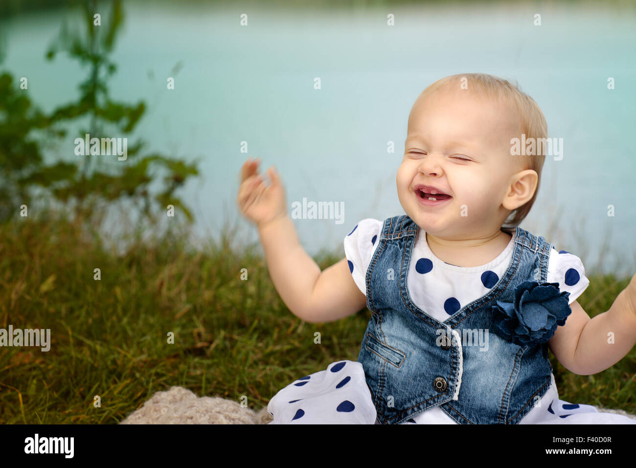 Baby at the Lake Stock Photo - Alamy