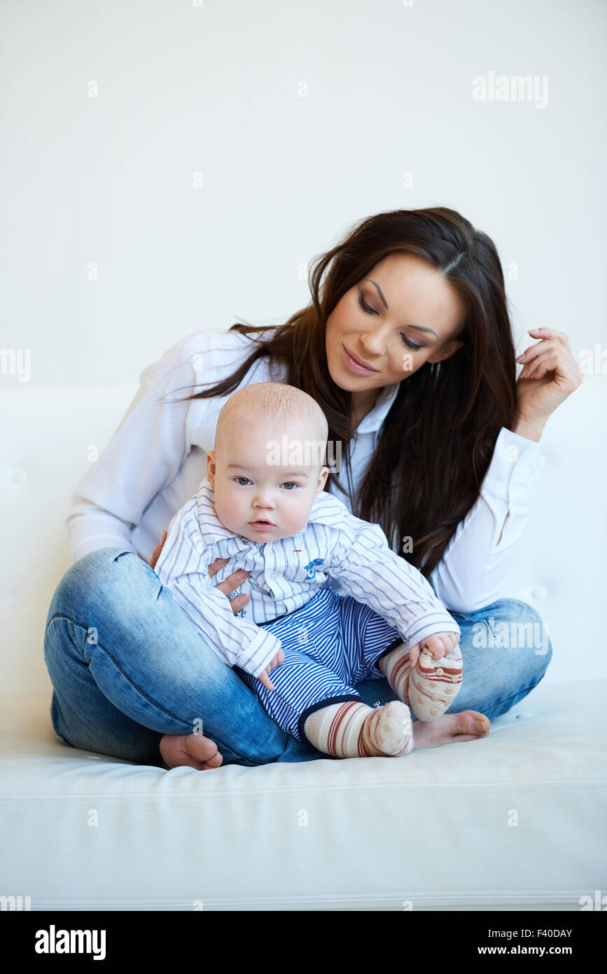 Sitting Pretty Mom with her Cute Baby Boy Stock Photo - Alamy
