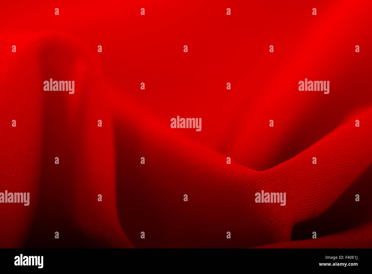 Beautiful background. Red fabric waves. macro Stock Photo - Alamy