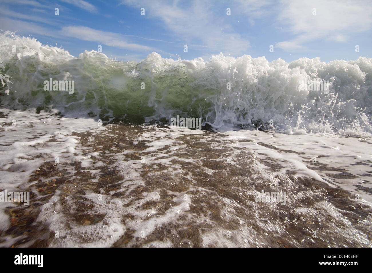 sea surf foamy beach wave nearby Stock Photo - Alamy