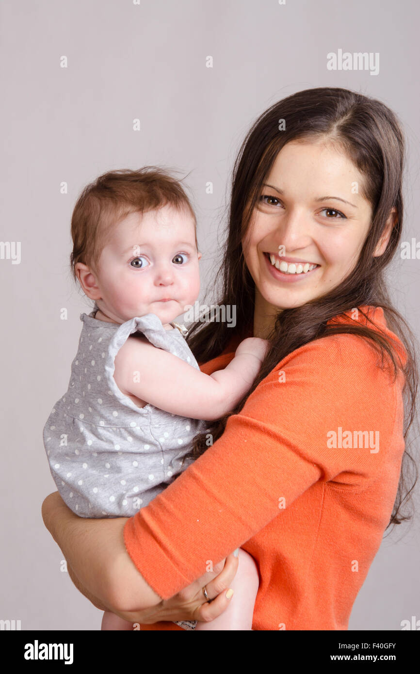 Young mother hugging her daughter Stock Photo - Alamy