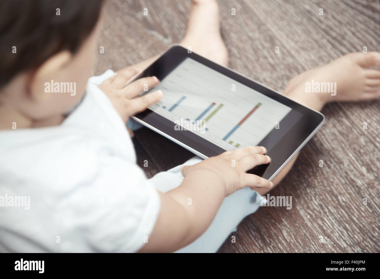 Baby with tablet computer Stock Photo - Alamy