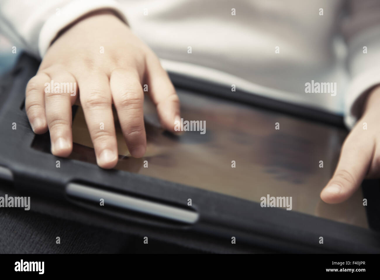 Baby with digital tablet Stock Photo - Alamy