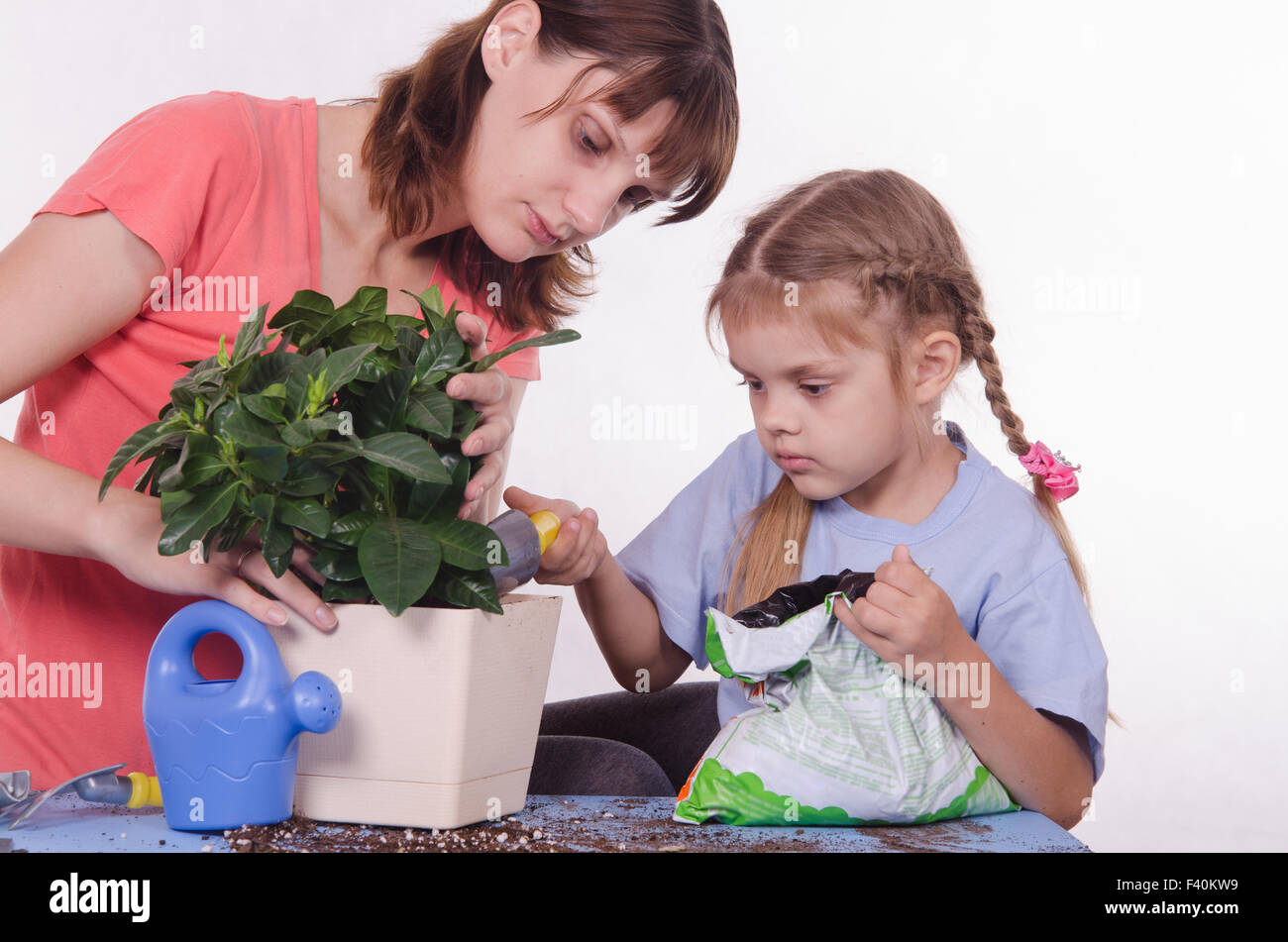 Girl child plant pot hi-res stock photography and images - Alamy