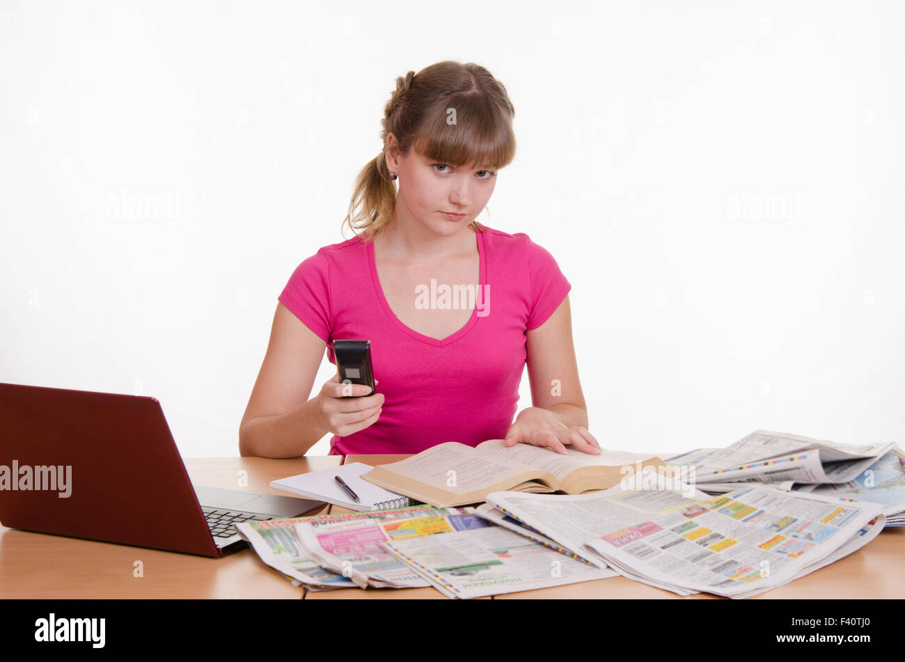 Athletic woman dials the phone book Stock Photo - Alamy