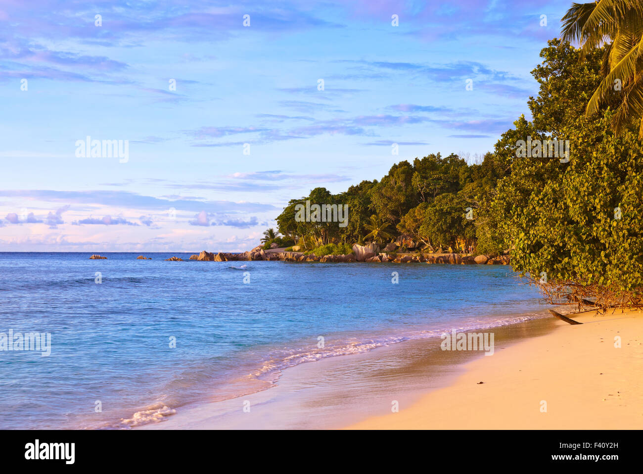 Sunset on tropical beach - Seychelles Stock Photo - Alamy