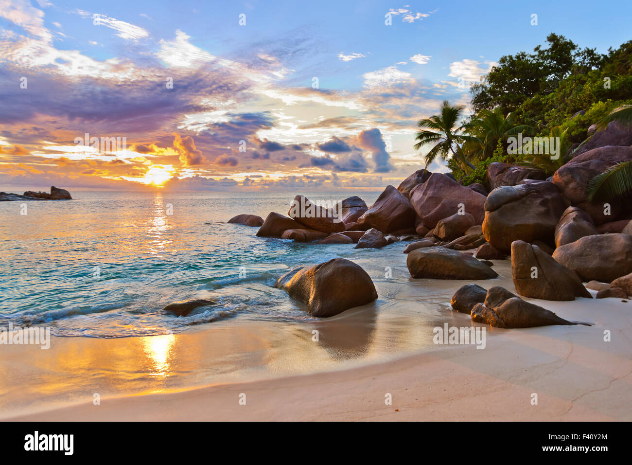Seychelles tropical beach at sunset Stock Photo - Alamy
