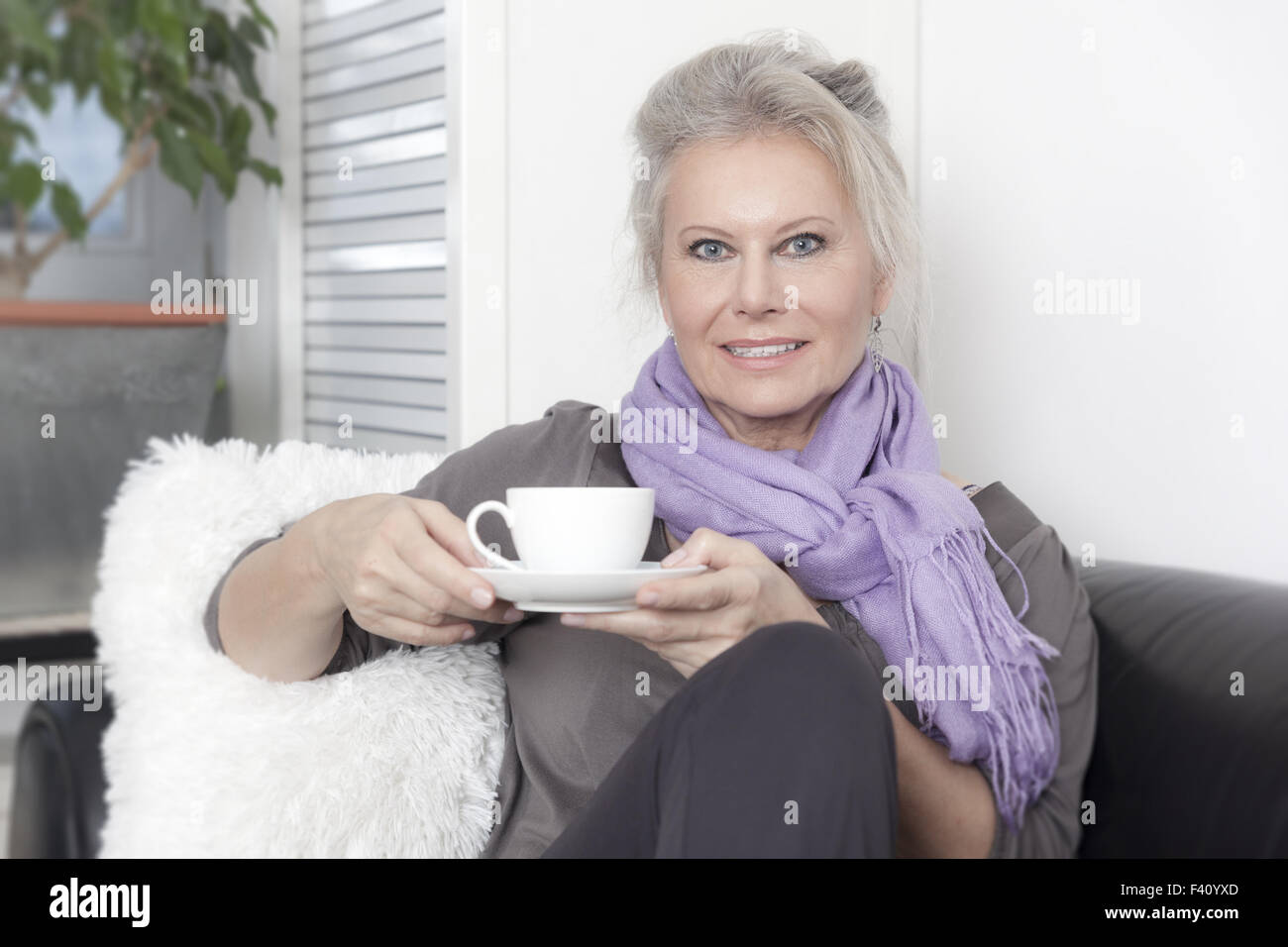 Older woman enjoying coffee hi-res stock photography and images - Alamy