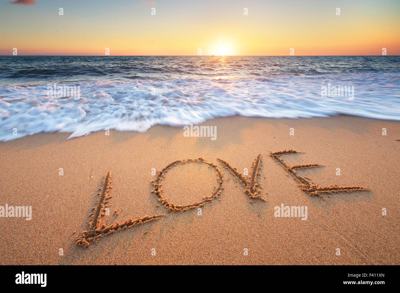 Love on the sea sand. Nature composition Stock Photo - Alamy