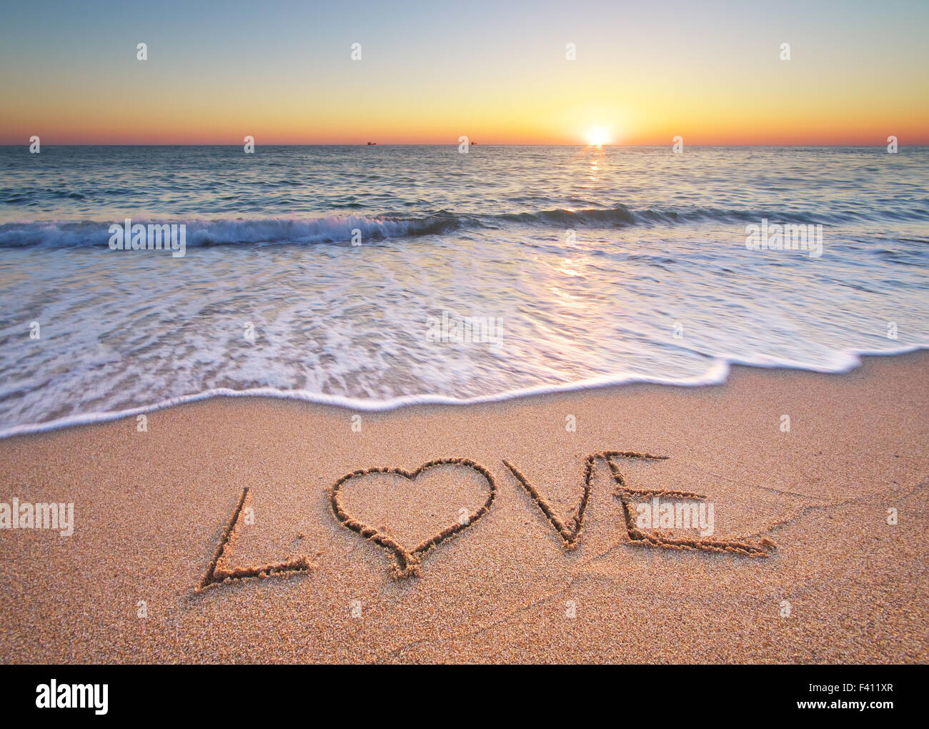 Love on the sea sand. Nature composition Stock Photo - Alamy