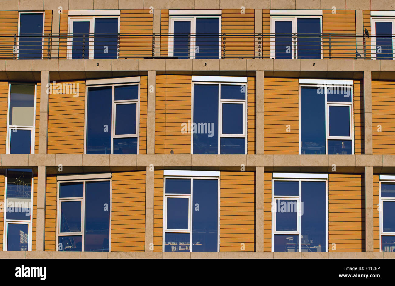 A facade of a modern orange office building Stock Photo - Alamy