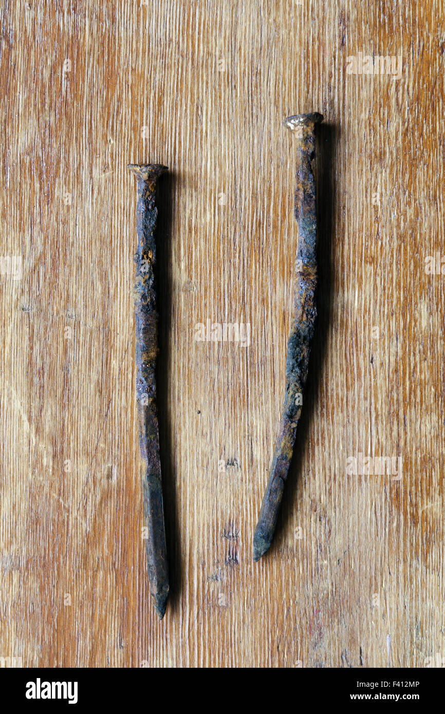 two rusty nails Stock Photo - Alamy