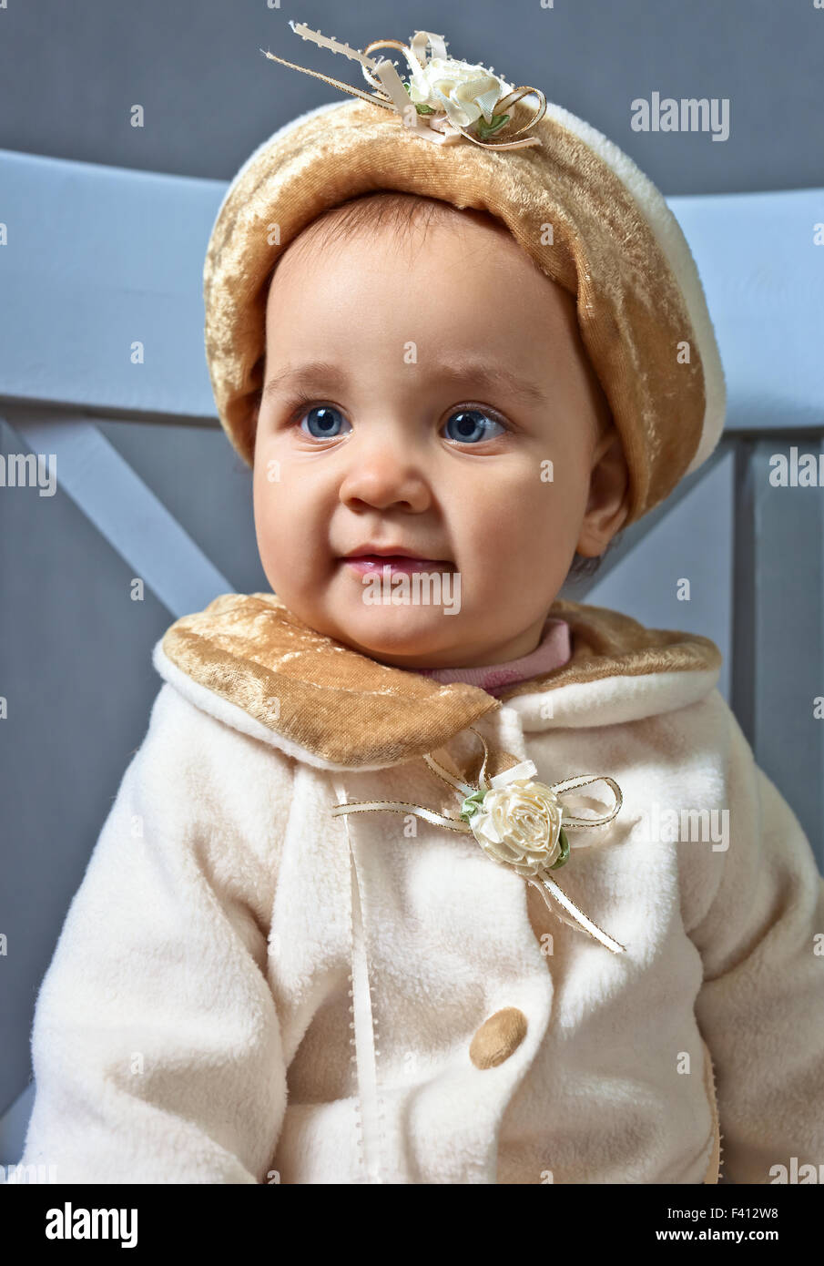 Portrait of a little girl in beige coat Stock Photo - Alamy