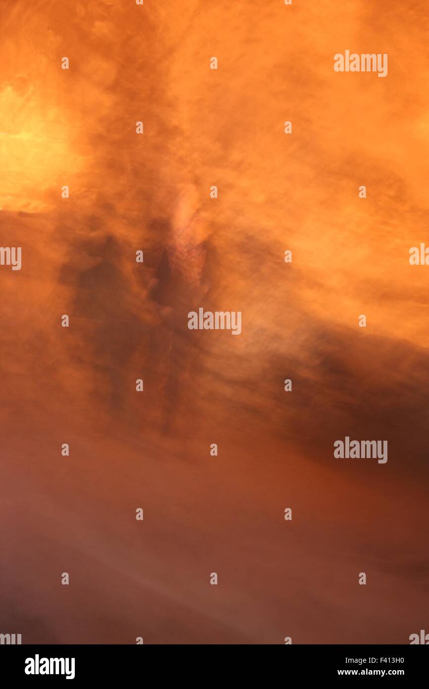 Shadowy, abstract figures walking through red fog, Germany Stock Photo ...