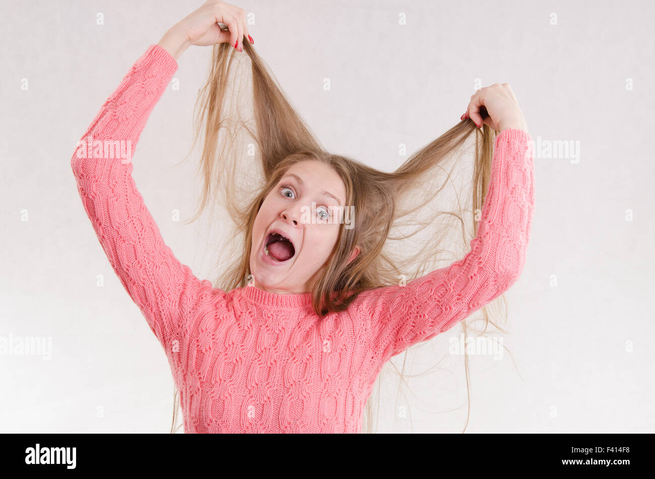 Girl shocked by her hair Stock Photo - Alamy