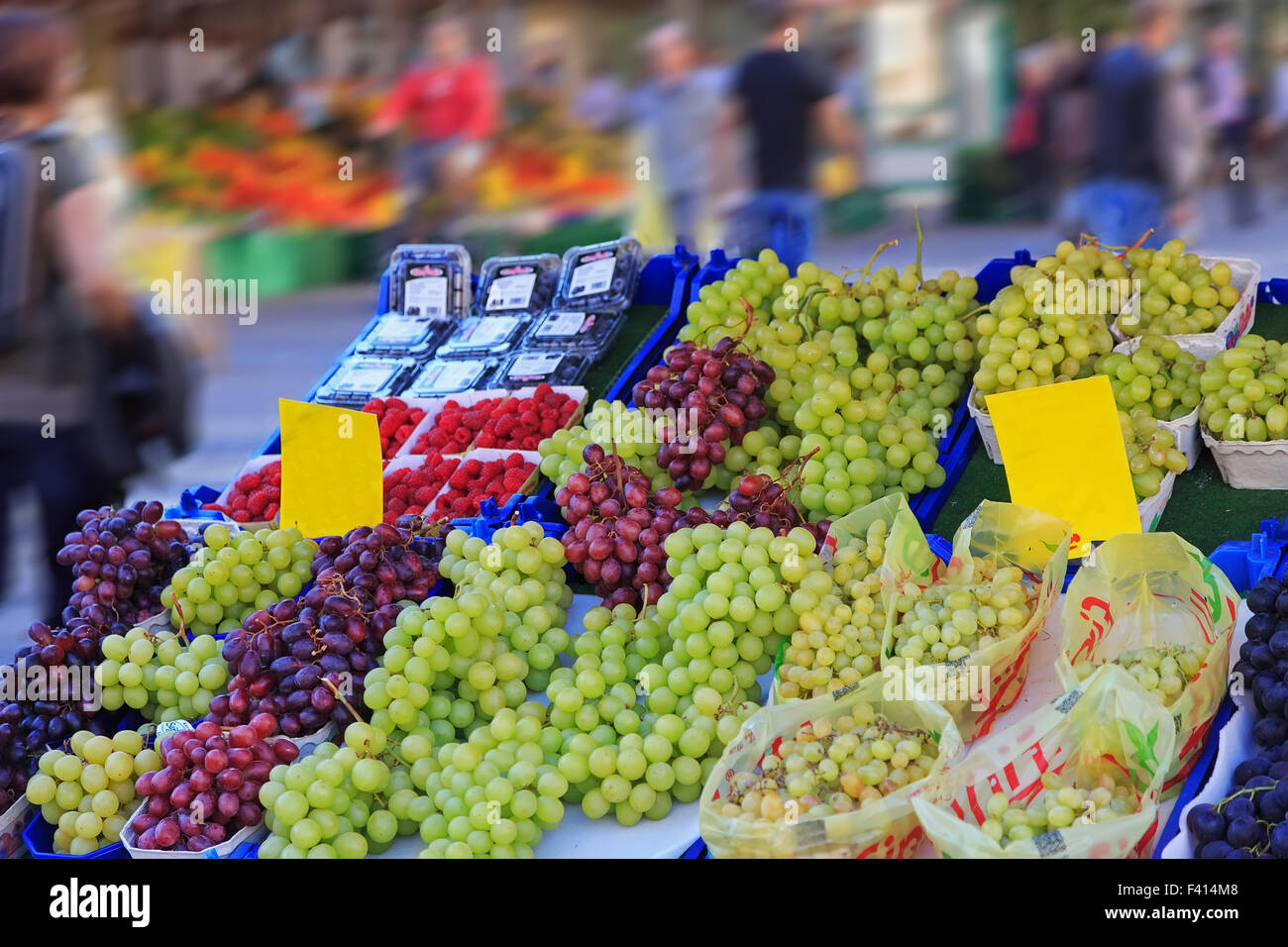 Grapes and raspberry on the european market Stock Photo - Alamy