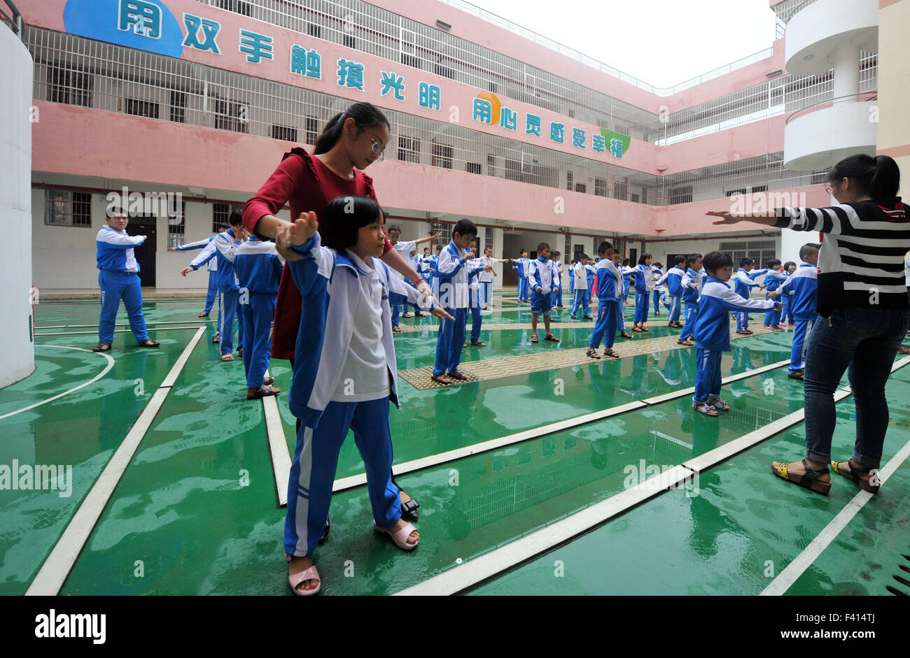 Haikou, China's Hainan Province. 13th Oct, 2015. Students do exercises ...
