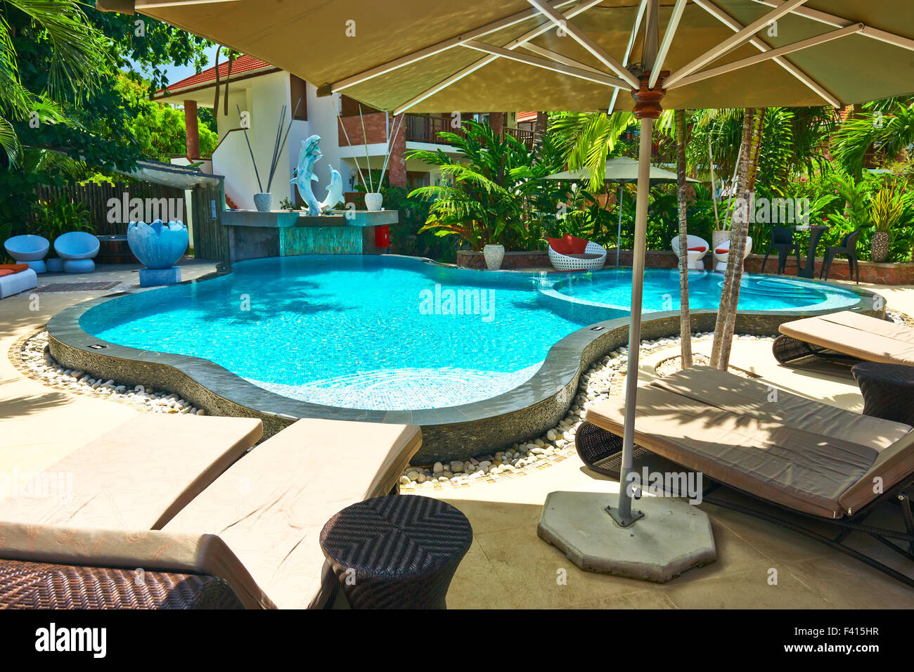 Luxury poolside area Stock Photo - Alamy