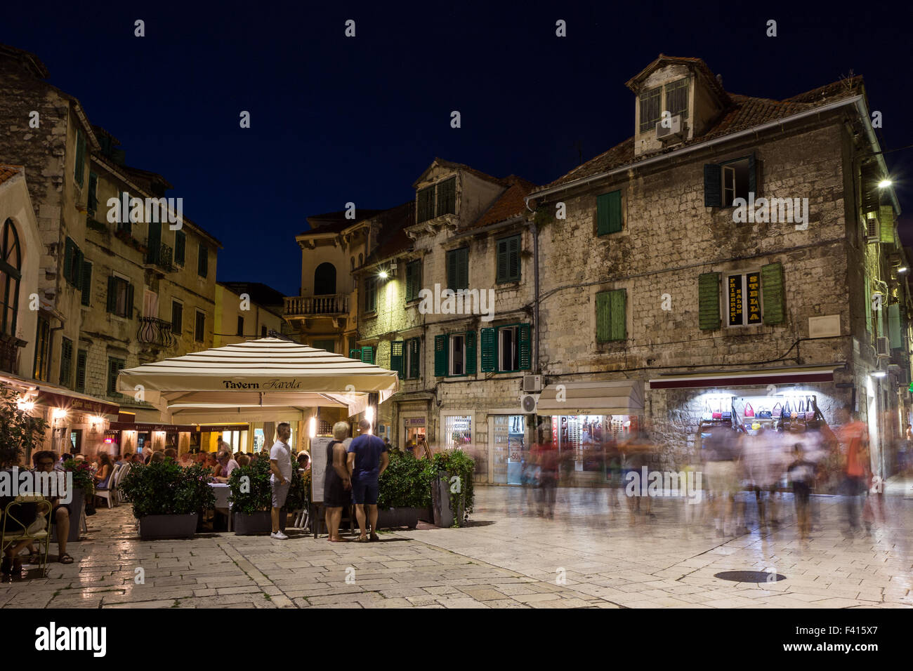 Tourists at a square at the Old Town in Split, Croatia, at night Stock ...
