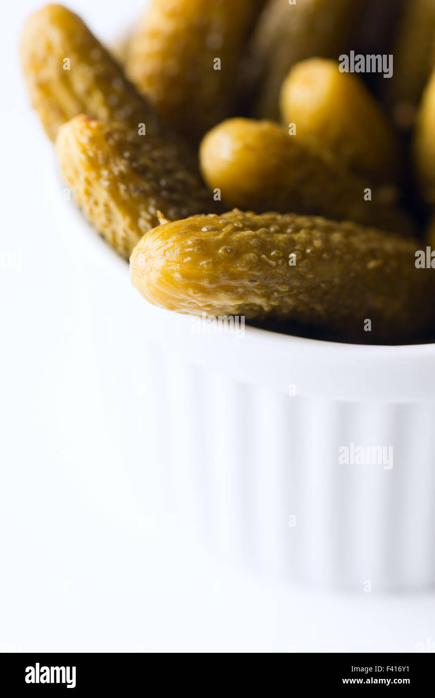 Tiny dill pickles in bowl macro Stock Photo - Alamy