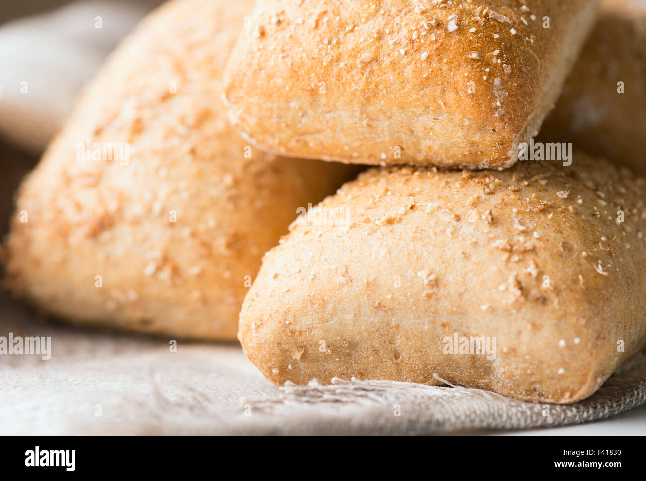 Oven baked bread on table close up Stock Photo - Alamy