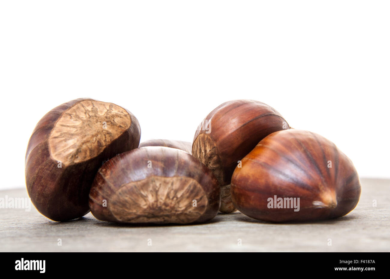 Fine sweet chestnuts. All on white background Stock Photo - Alamy
