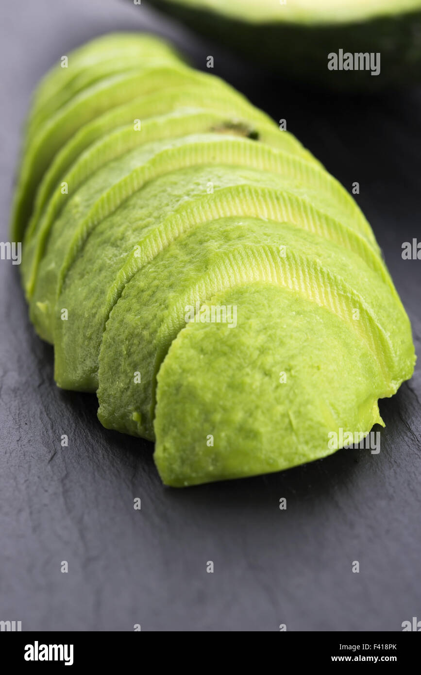 ripe cleaned peeled avocado sliced Stock Photo - Alamy