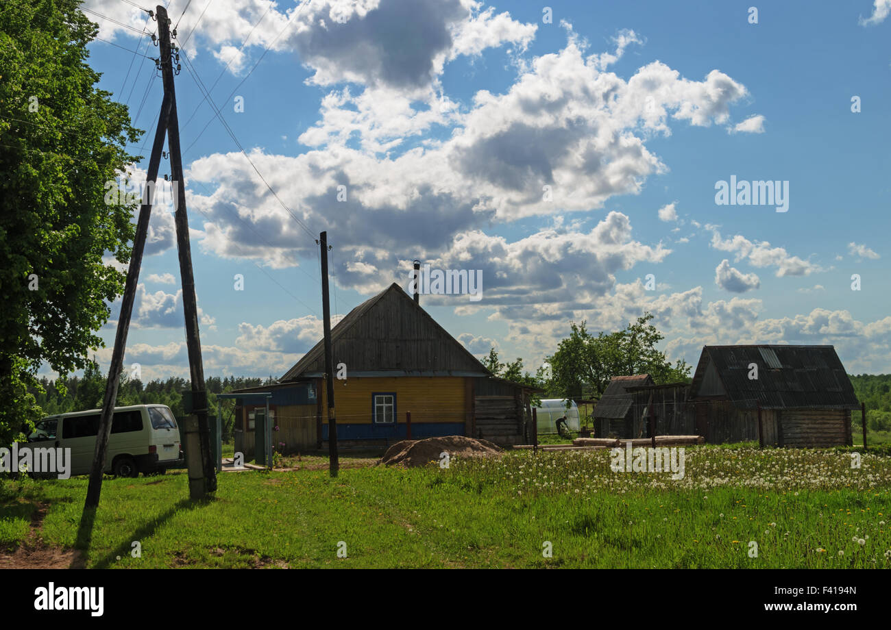 Village summer landscape - log-houses Stock Photo - Alamy