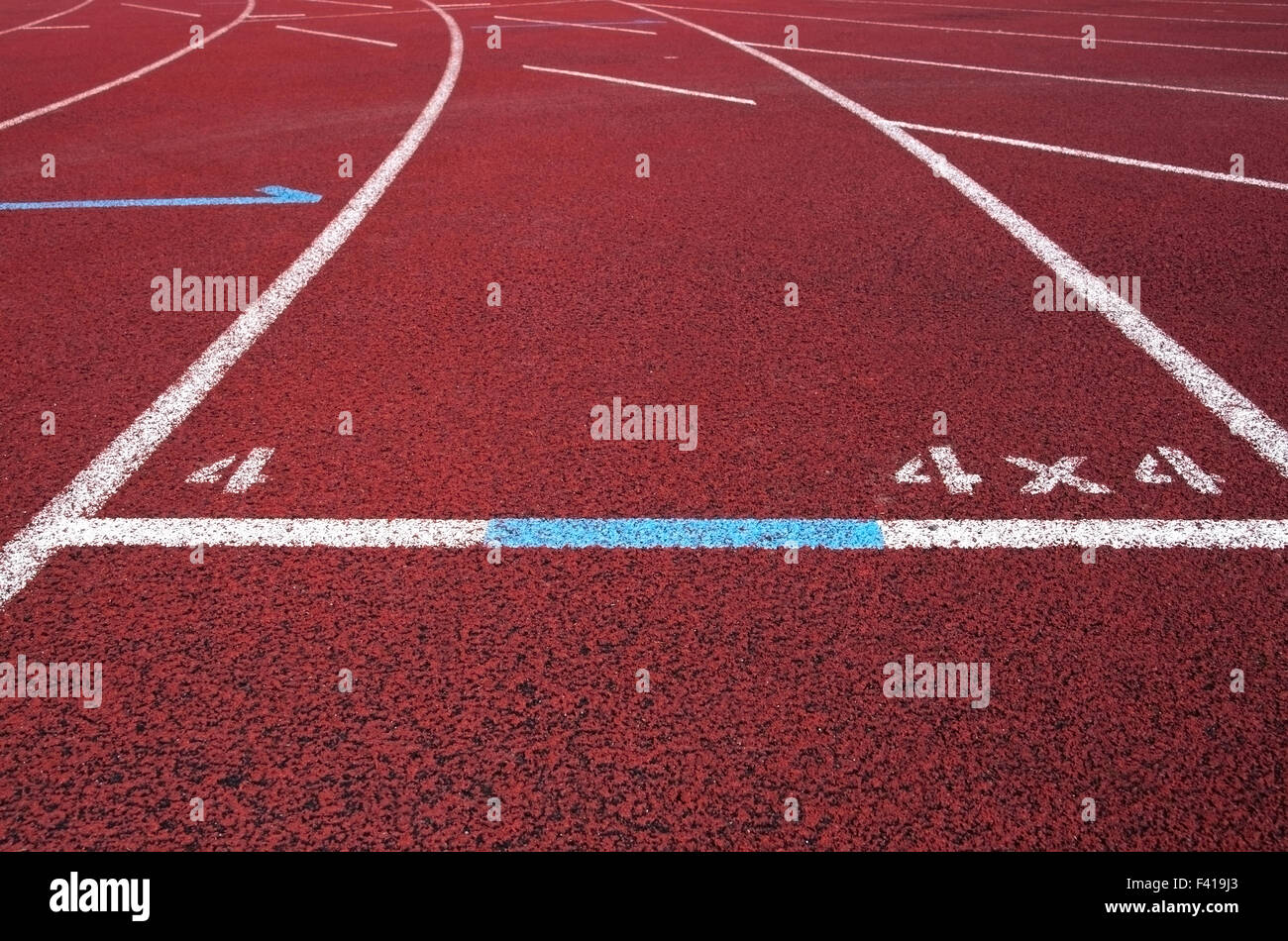 Red running field track Stock Photo - Alamy