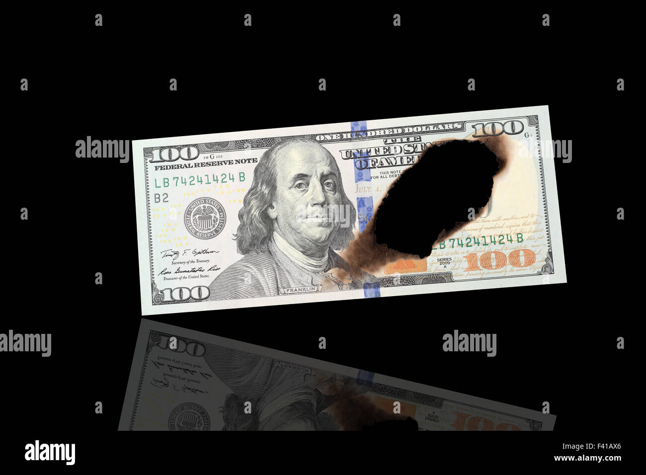 Burning 100 dollar bill hi-res stock photography and images - Alamy
