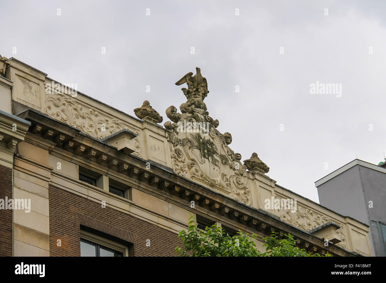 Pediment of an ancient building in Amsterdam Stock Photo - Alamy