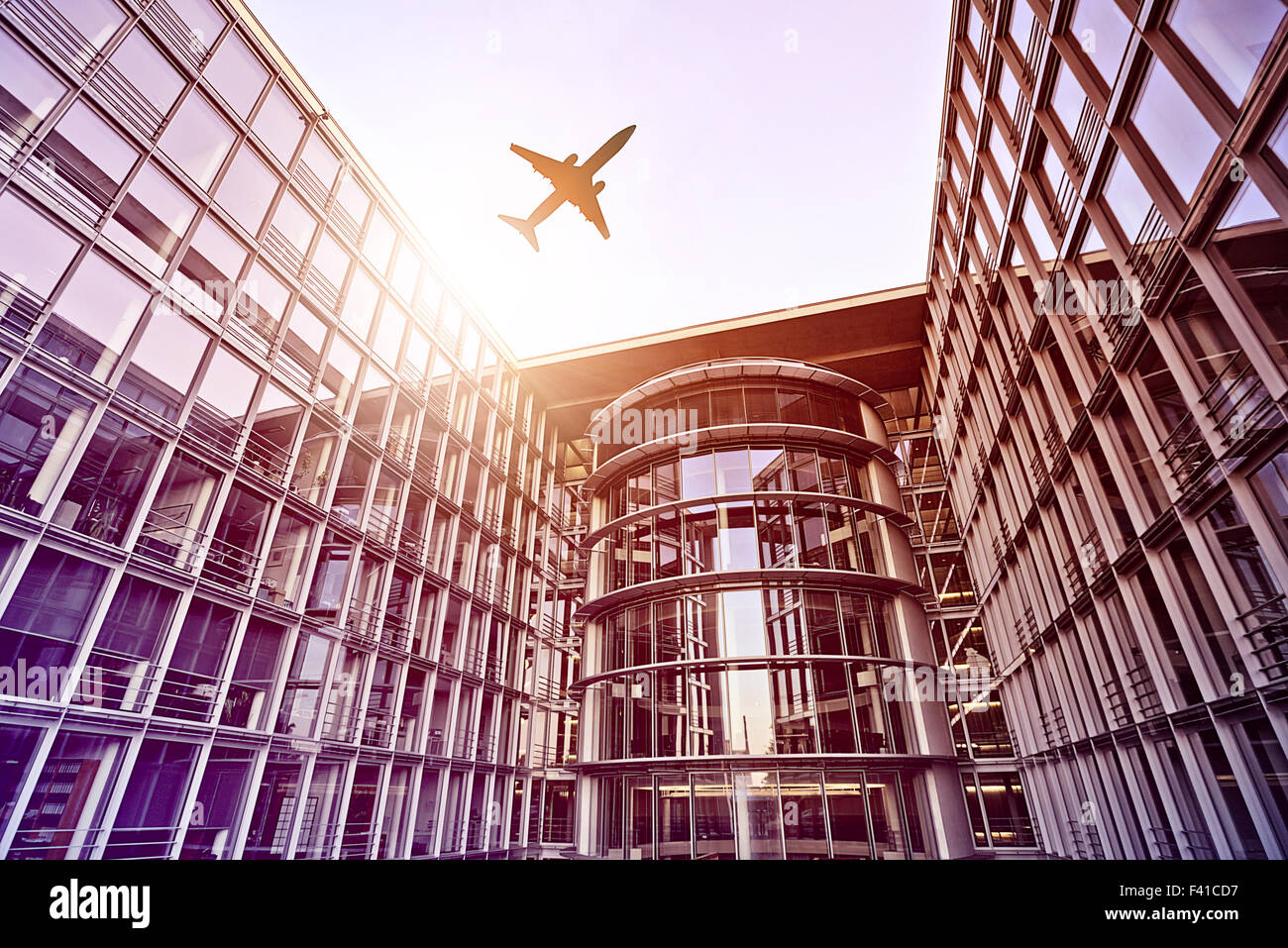 plane over office building Stock Photo - Alamy