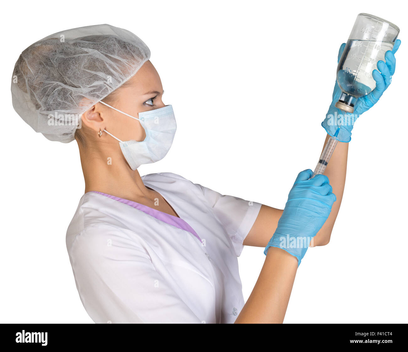Female doctor picking up the syringe injection Stock Photo - Alamy