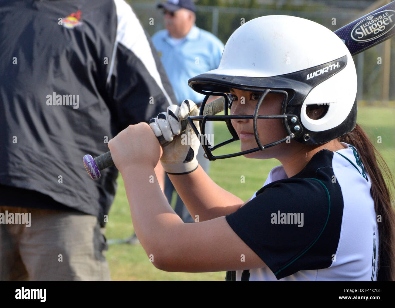 female batter in a high school softball game Stock Photo - Alamy