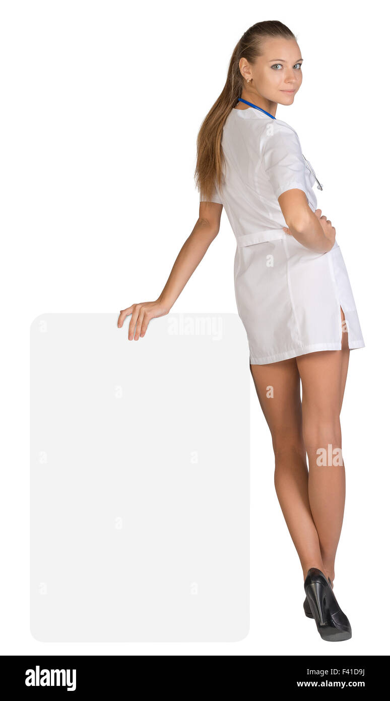 Young woman doctor standing backward, leaning hand on an empty ...