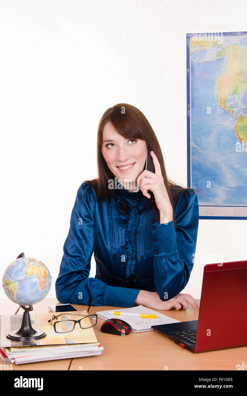 Travel agency manager talking on the phone Stock Photo - Alamy