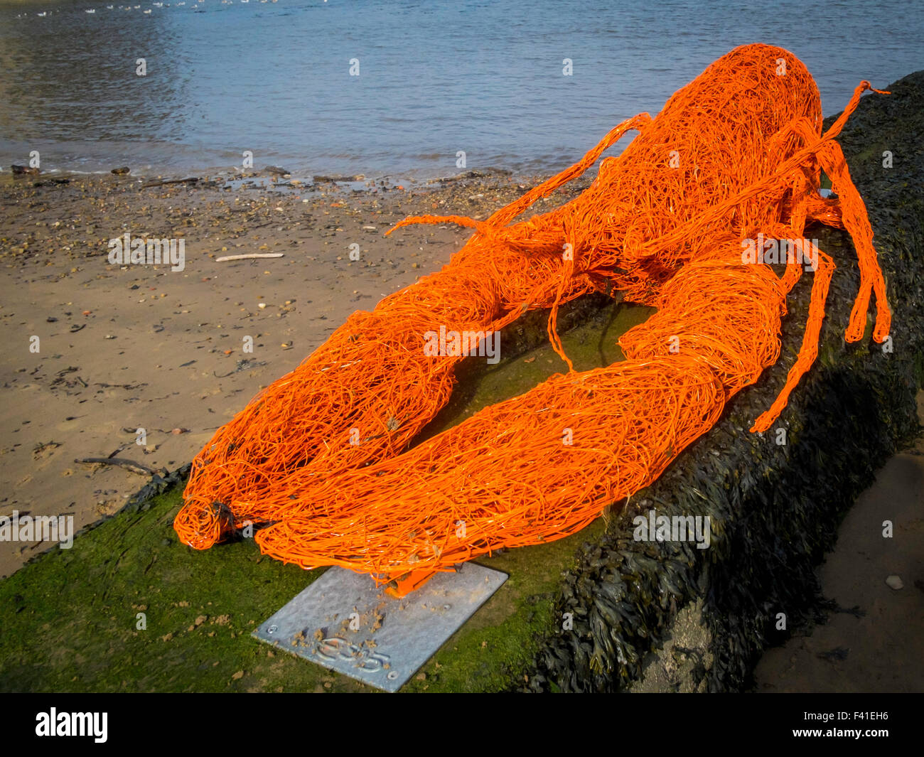 A large bright coral coloured sculpture of a lobster by Whitby sculptor ...