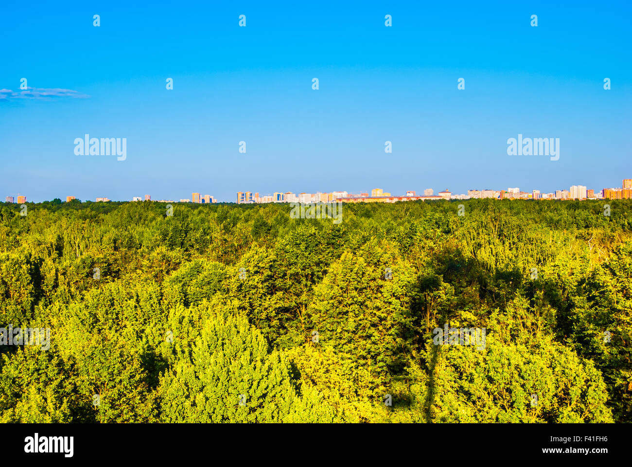 Landscape with city buildings in distance Stock Photo - Alamy