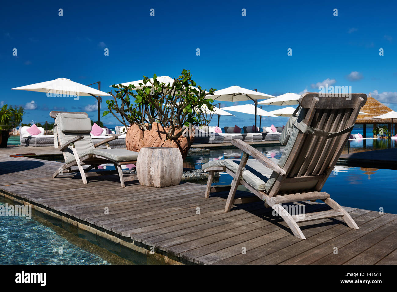 Luxury poolside jetty Stock Photo - Alamy