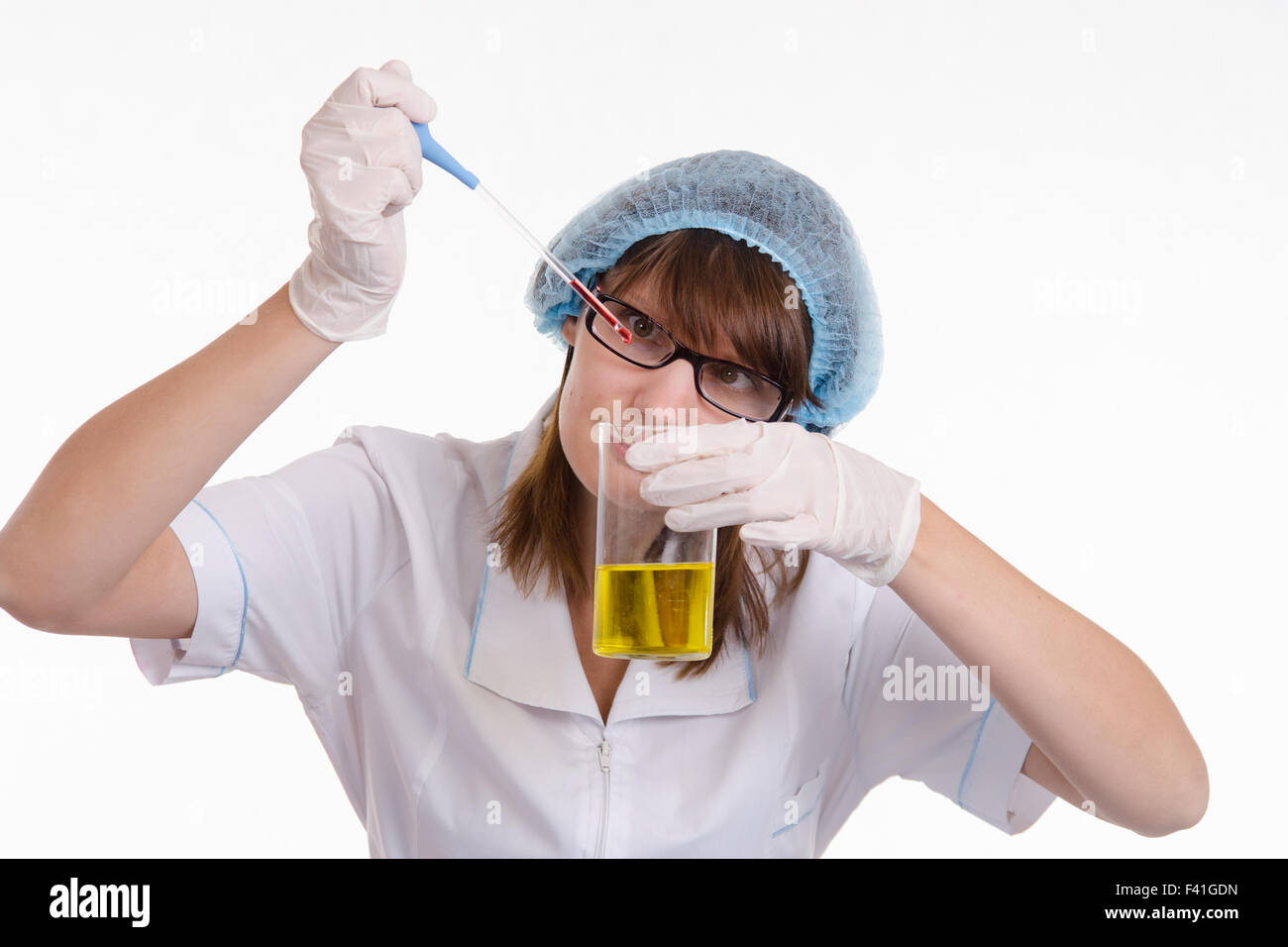 Chemist finds drops falling into a flask Stock Photo - Alamy