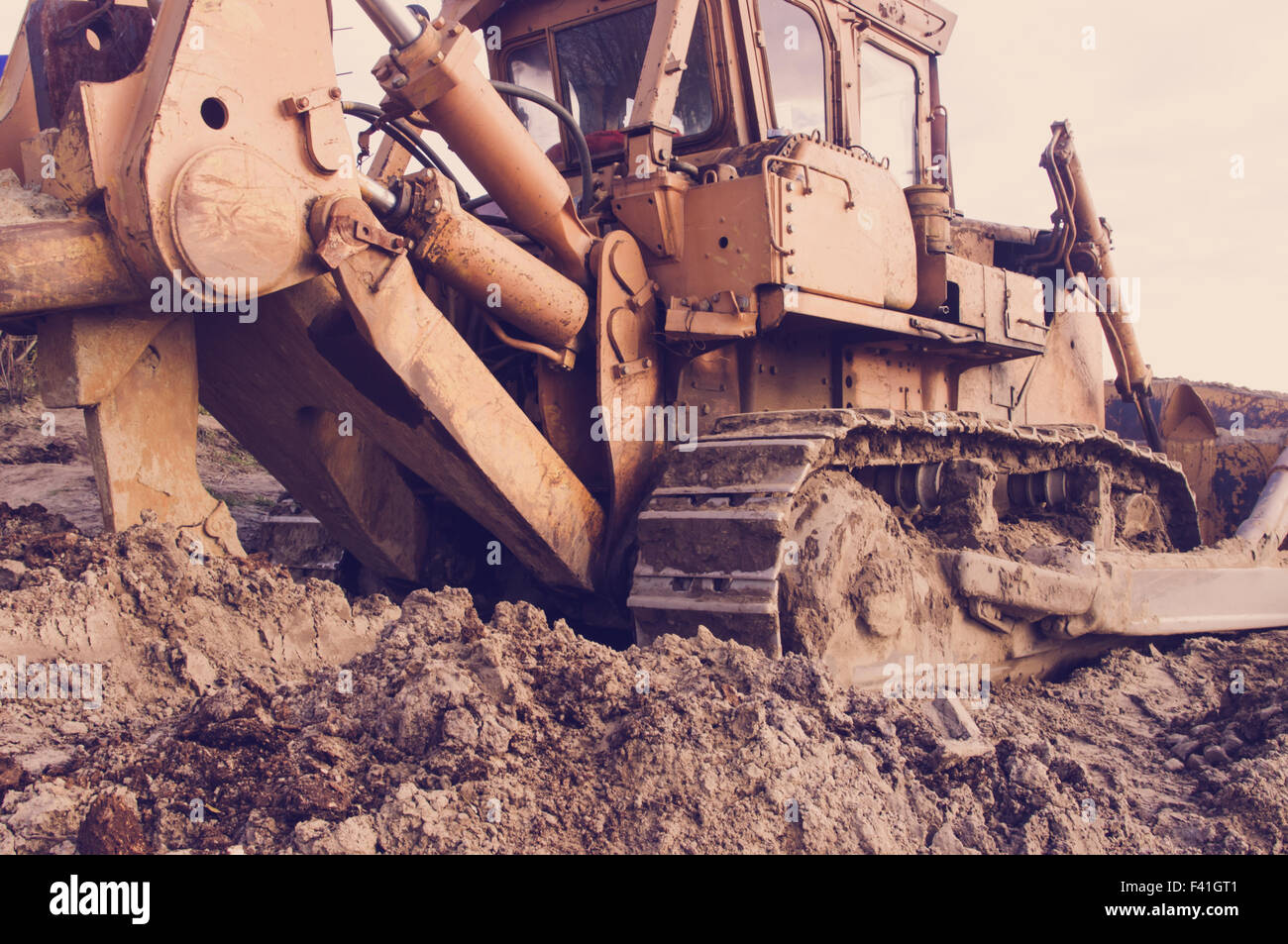 Old bulldozer ripper in the mud and sand Stock Photo - Alamy