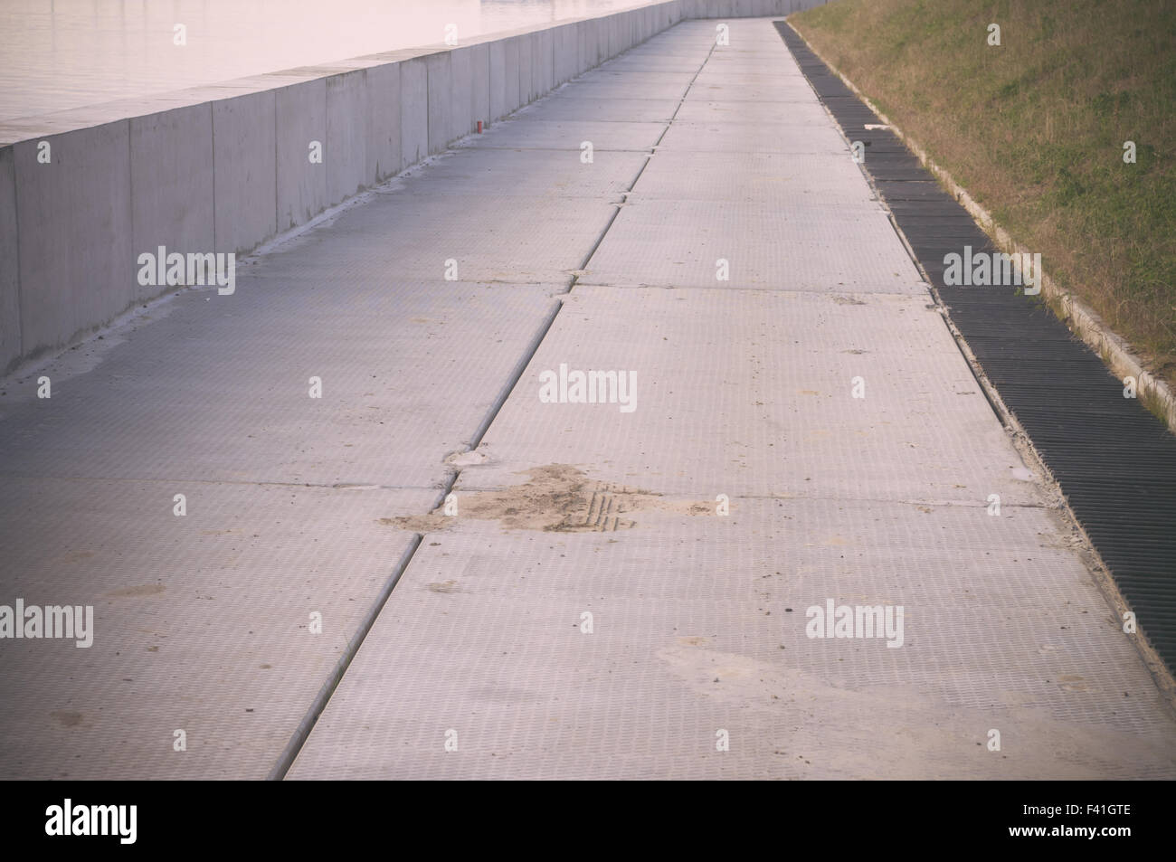 Embankment concrete slabs dam on the river Stock Photo - Alamy