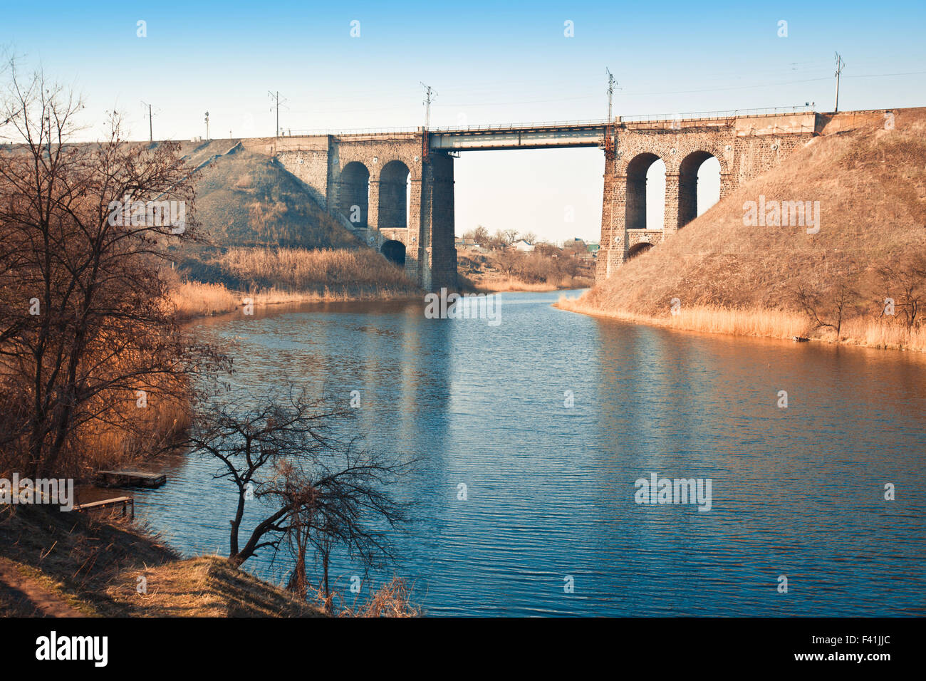 Very old stone bridge over the river Stock Photo - Alamy