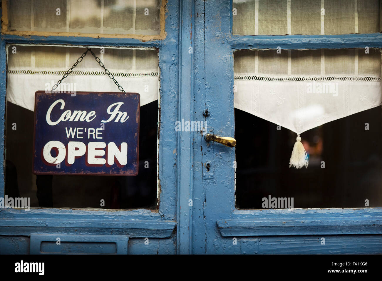 Open sign on the door of an old French bistro Stock Photo - Alamy