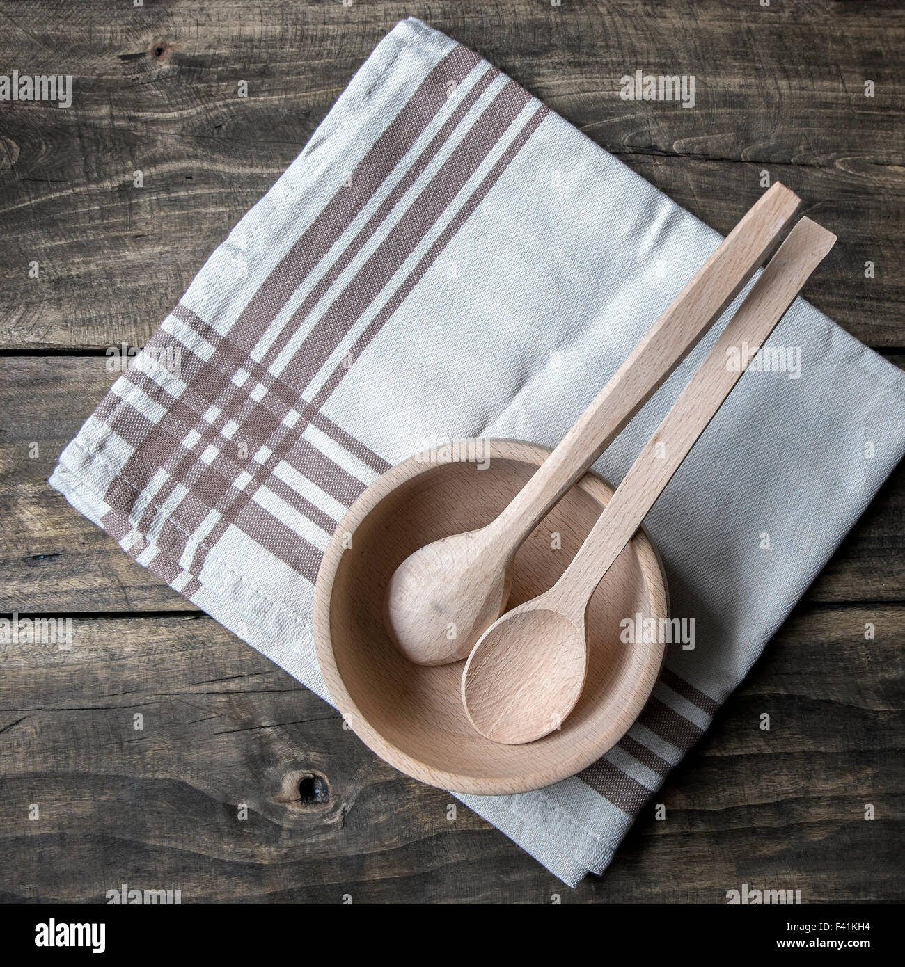 Wooden kitchen utensils on wooden table, from above Stock Photo - Alamy
