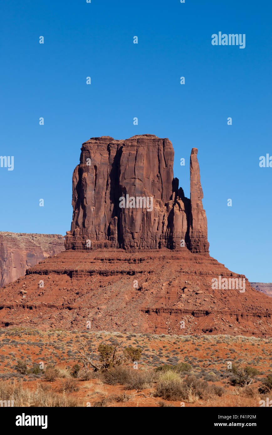 West Mitten rock feature in Monument Valley on a clear day with a blue ...